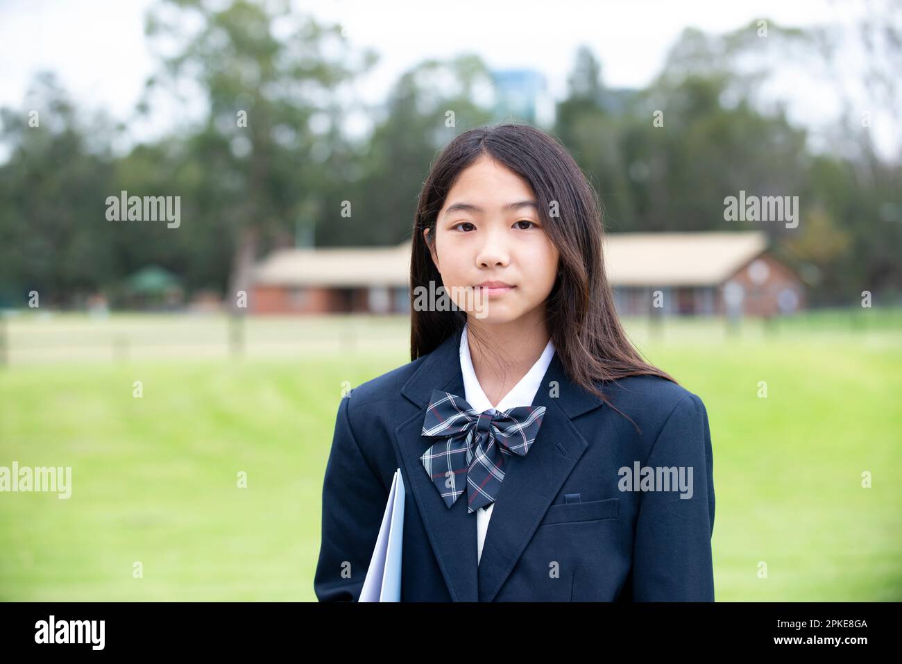 Female student in school uniform looking at us Stock Photo - Alamy