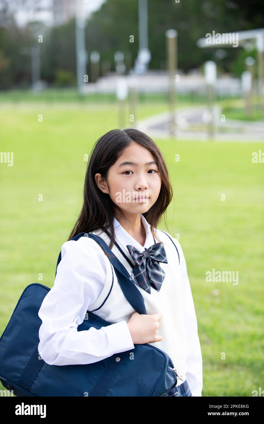 Female student in school uniform looking at you Stock Photo - Alamy