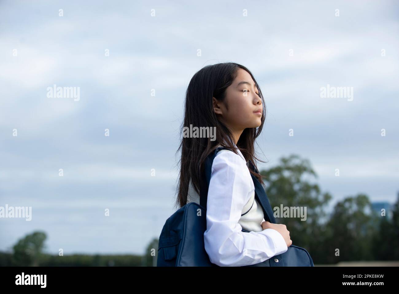 School girl profile school uniform hi-res stock photography and images ...