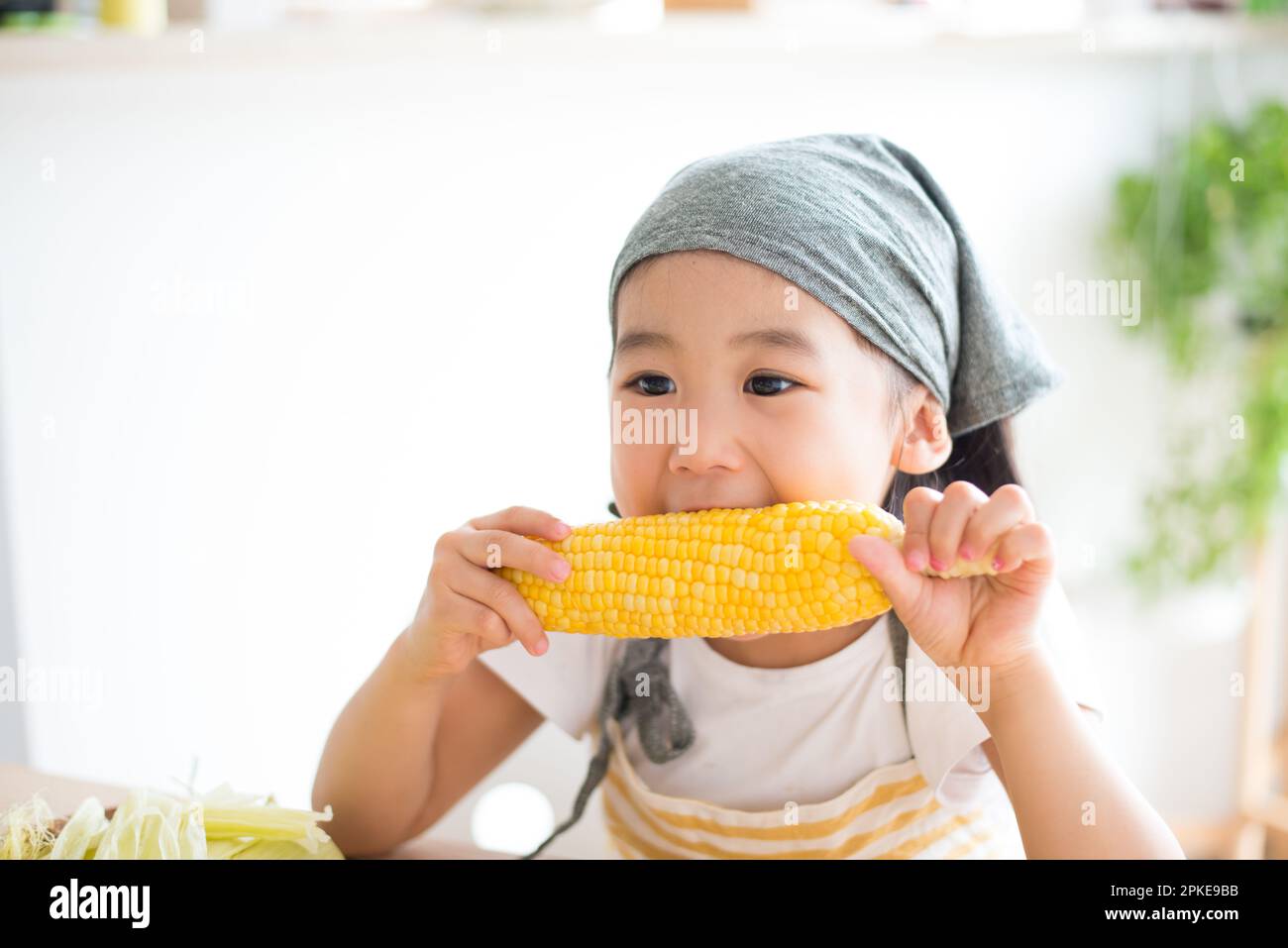 Young girl eating corn snack hi-res stock photography and images - Alamy
