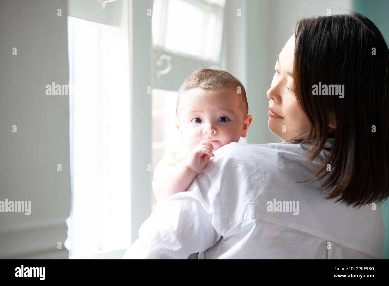 Happy baby being held hi-res stock photography and images - Alamy