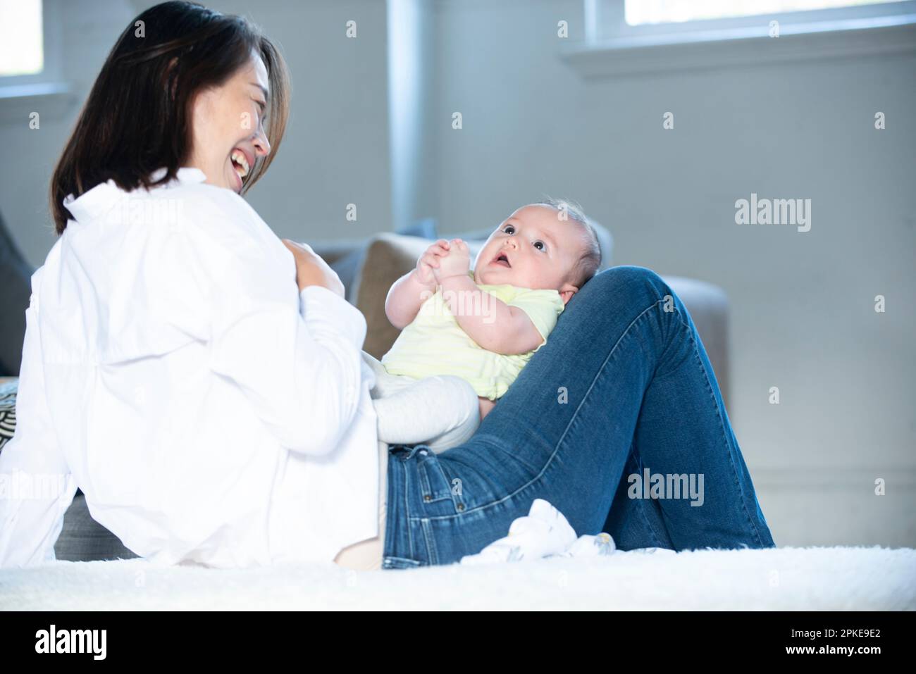 Asian parent nursing baby hi-res stock photography and images - Alamy