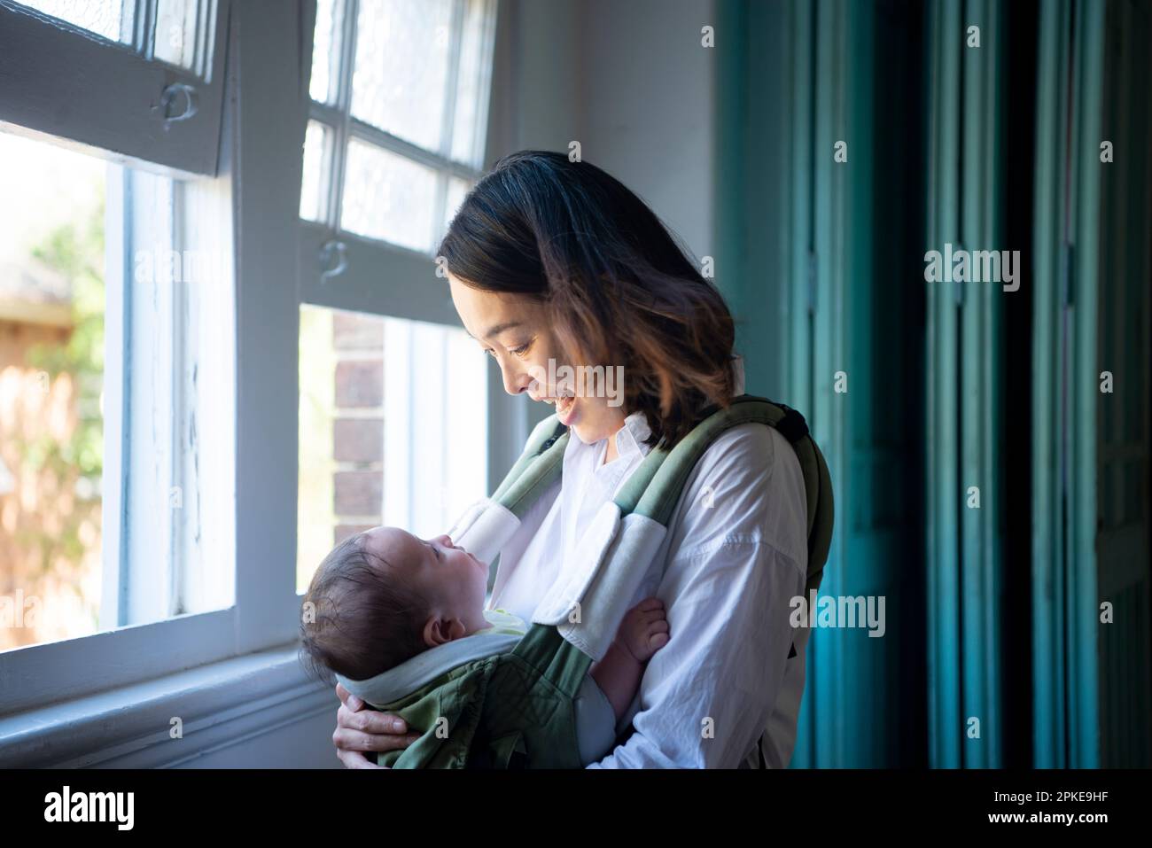 Baby and mother being carried Stock Photo - Alamy