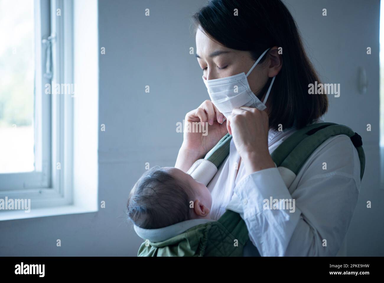 Child carrying a baby hi-res stock photography and images - Alamy