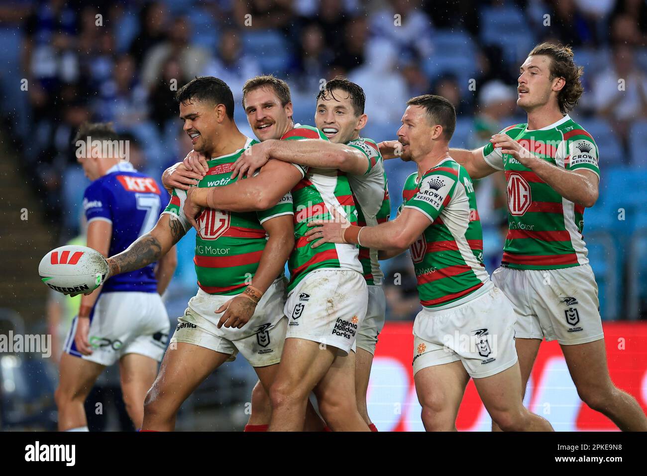 Latrell Mitchell of Souths celebrates his third try with team mates ...