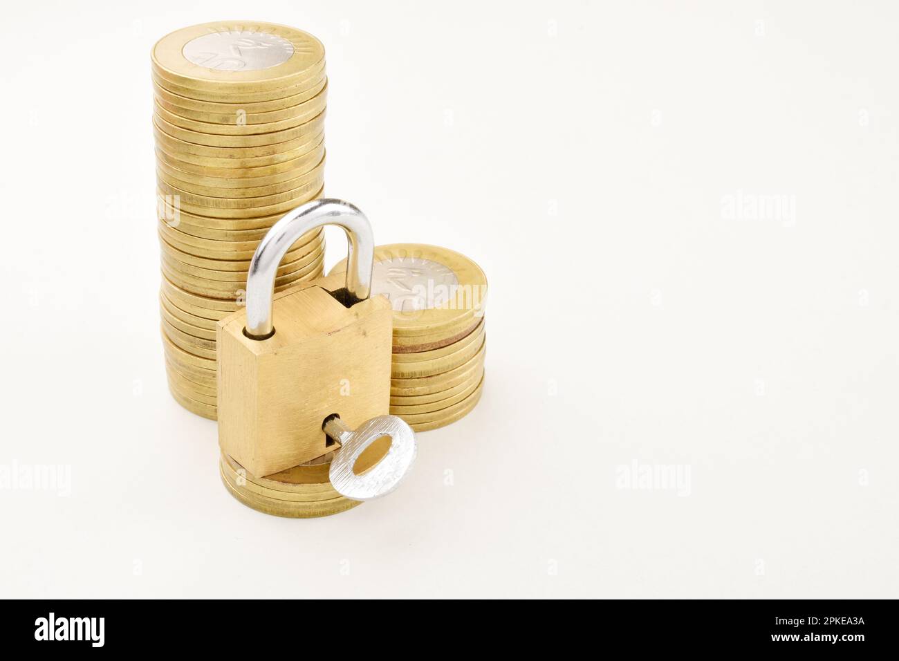 Key lock with coin stack on white background, bank account passowrd ...