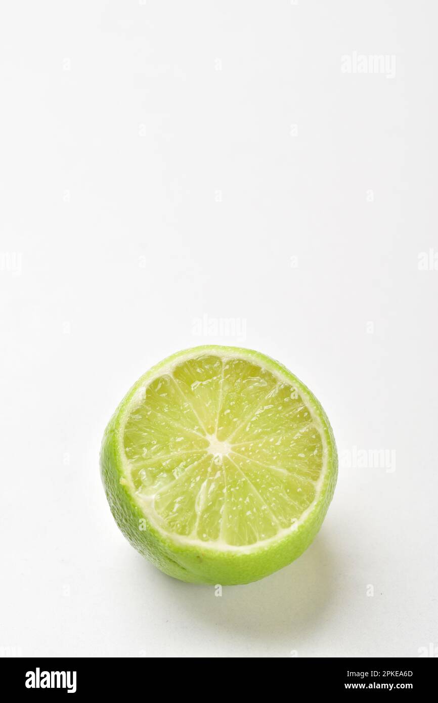 Vertical view of green lemon isolated on white background Stock Photo ...