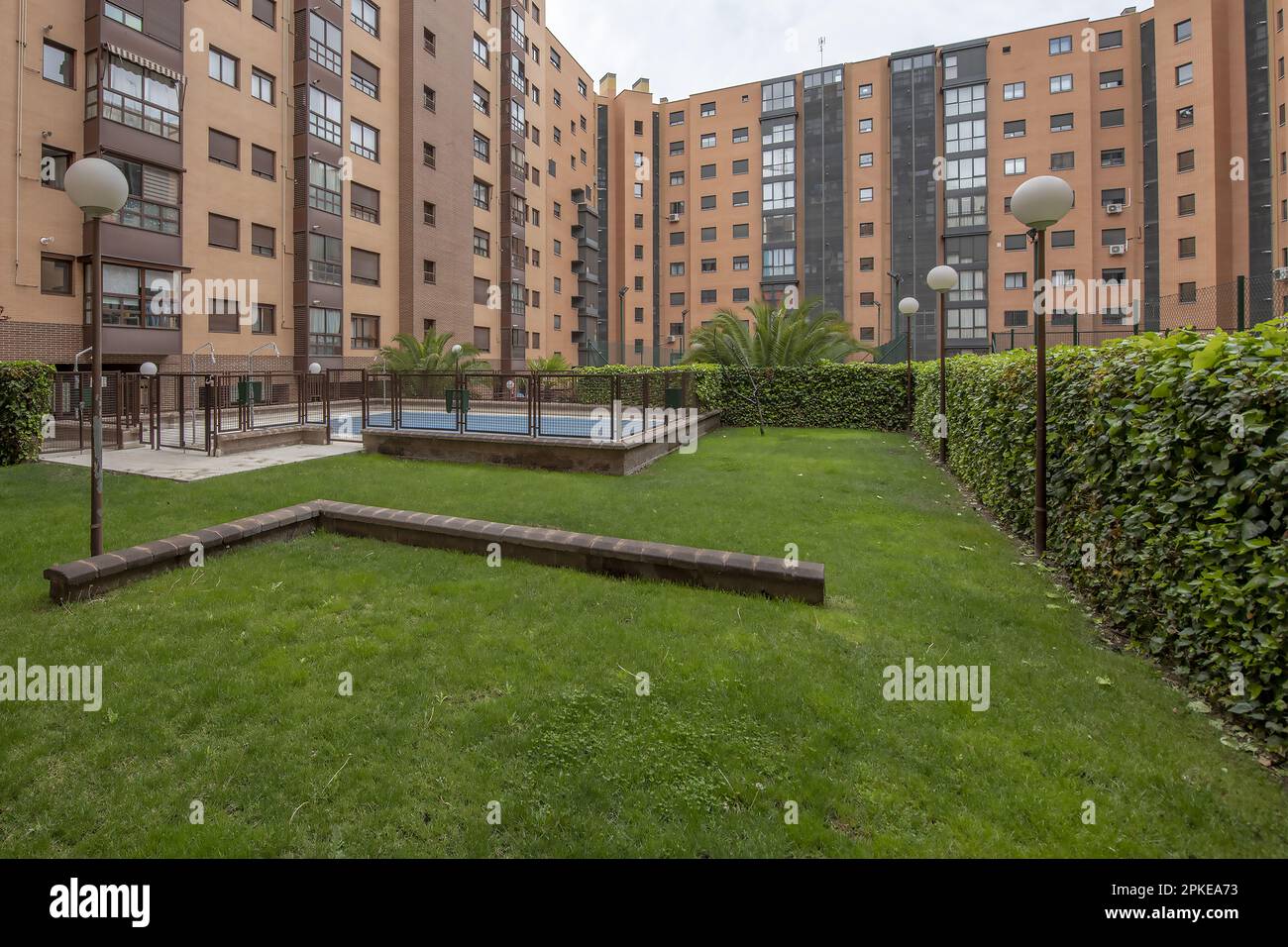 Interior common areas of a residential complex with a lot of grass ...