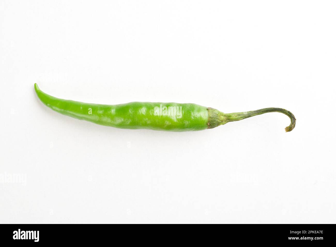Fresh green chilli on white background Stock Photo - Alamy