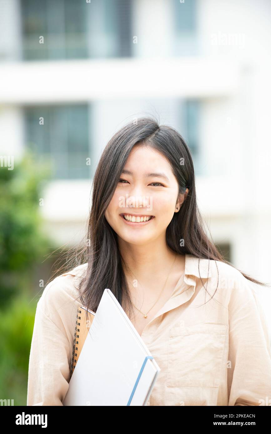 Teenager notebook looking camera smiling hi-res stock photography and ...