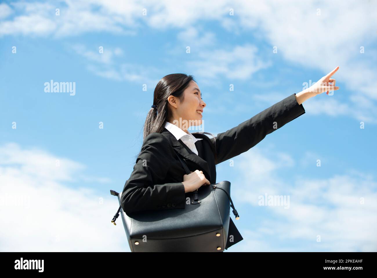 Woman pointing at sky hi-res stock photography and images - Alamy