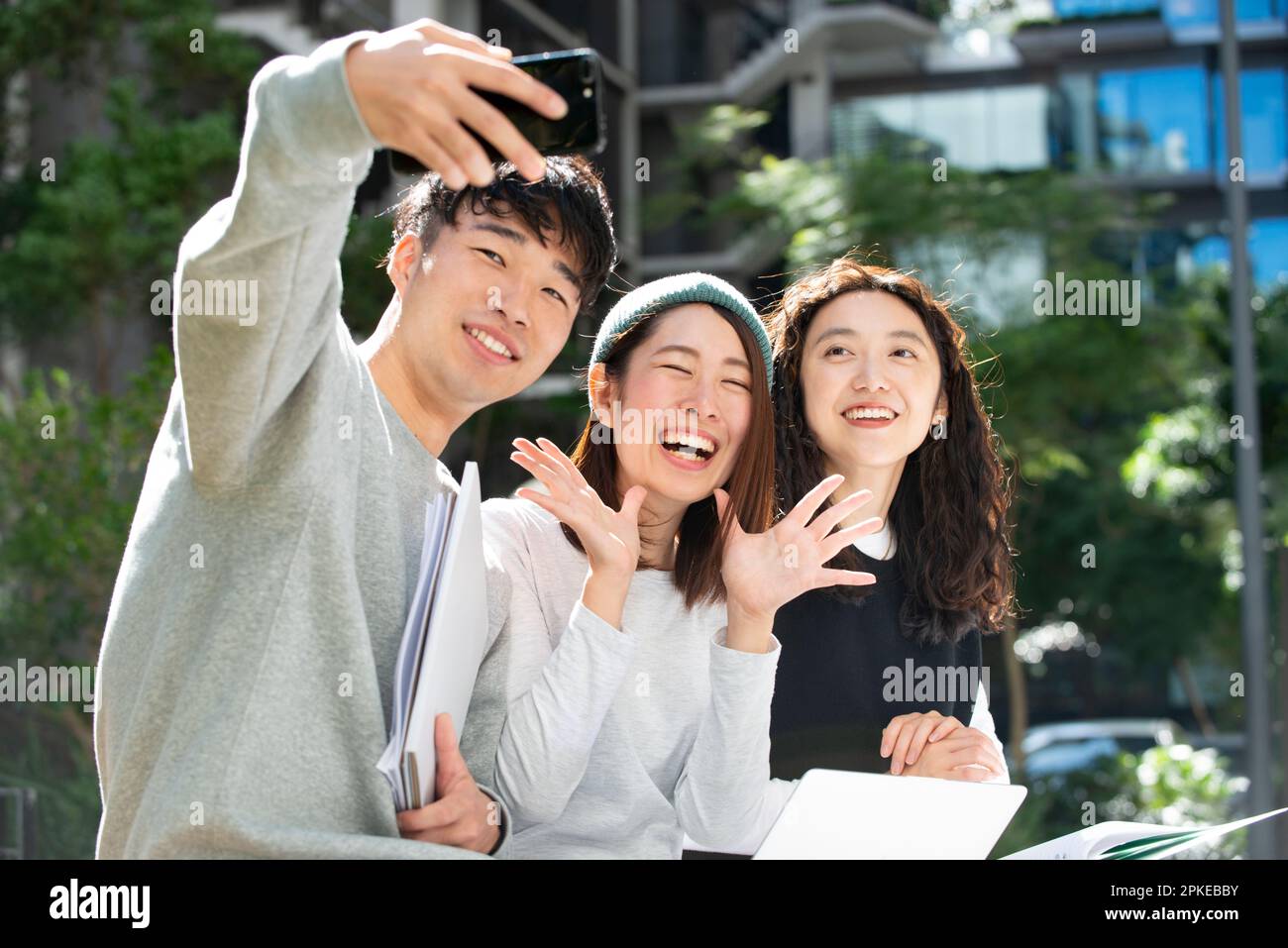 Young japanese man smiles hi-res stock photography and images - Alamy