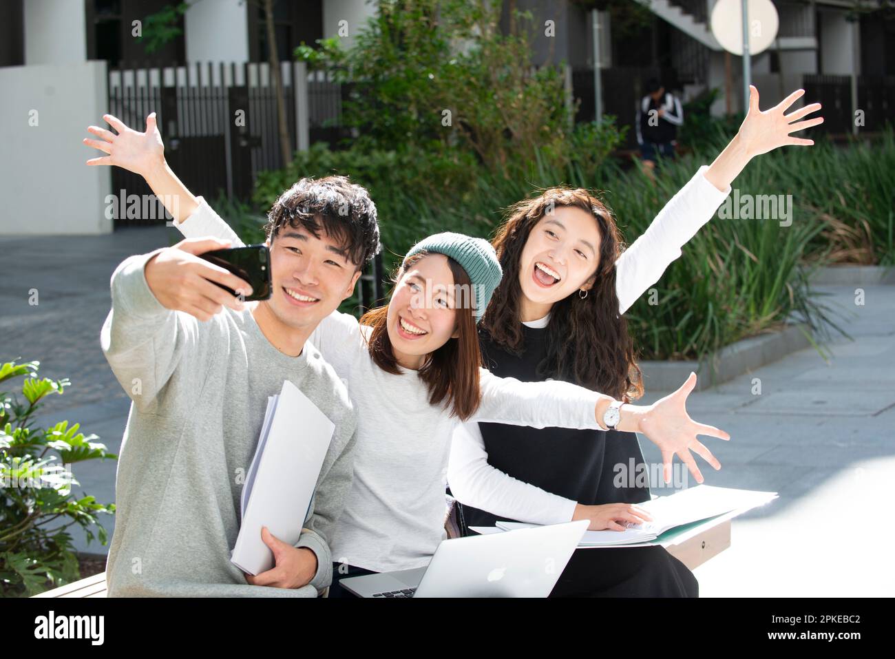 Three students taking selfies with smiles on their faces Stock Photo ...