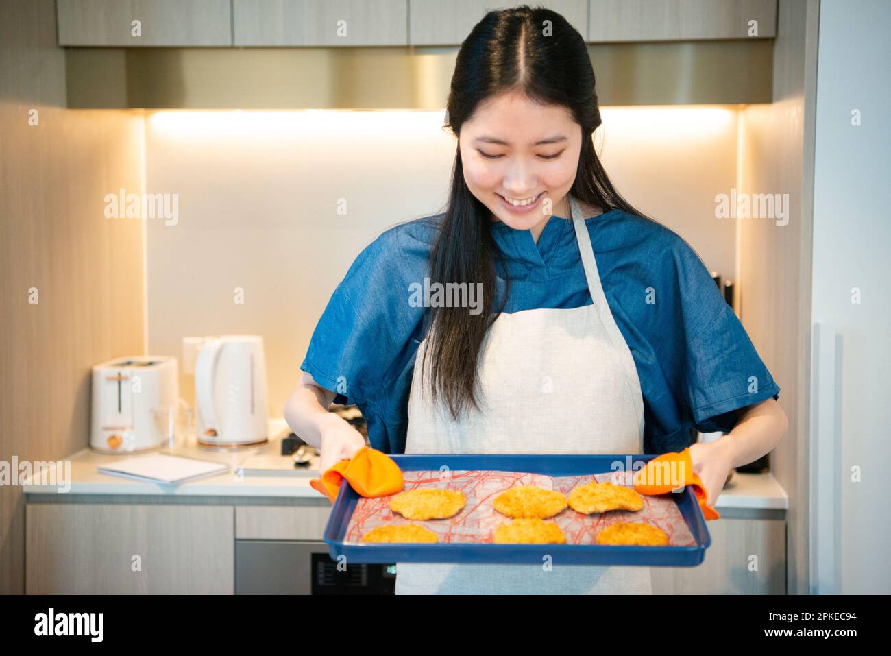 Smiling woman baking homemade hi-res stock photography and images - Alamy