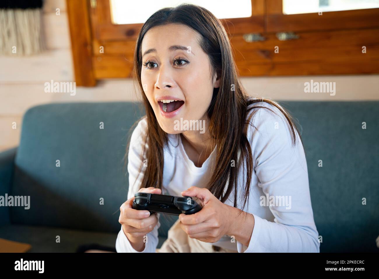 Woman playing a game Stock Photo - Alamy