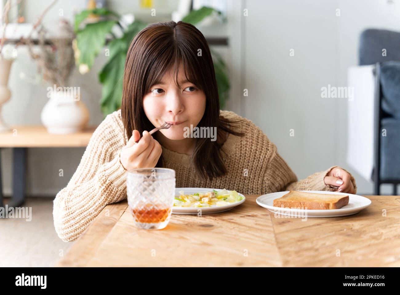 Girl eating toast breakfast hi-res stock photography and images - Alamy