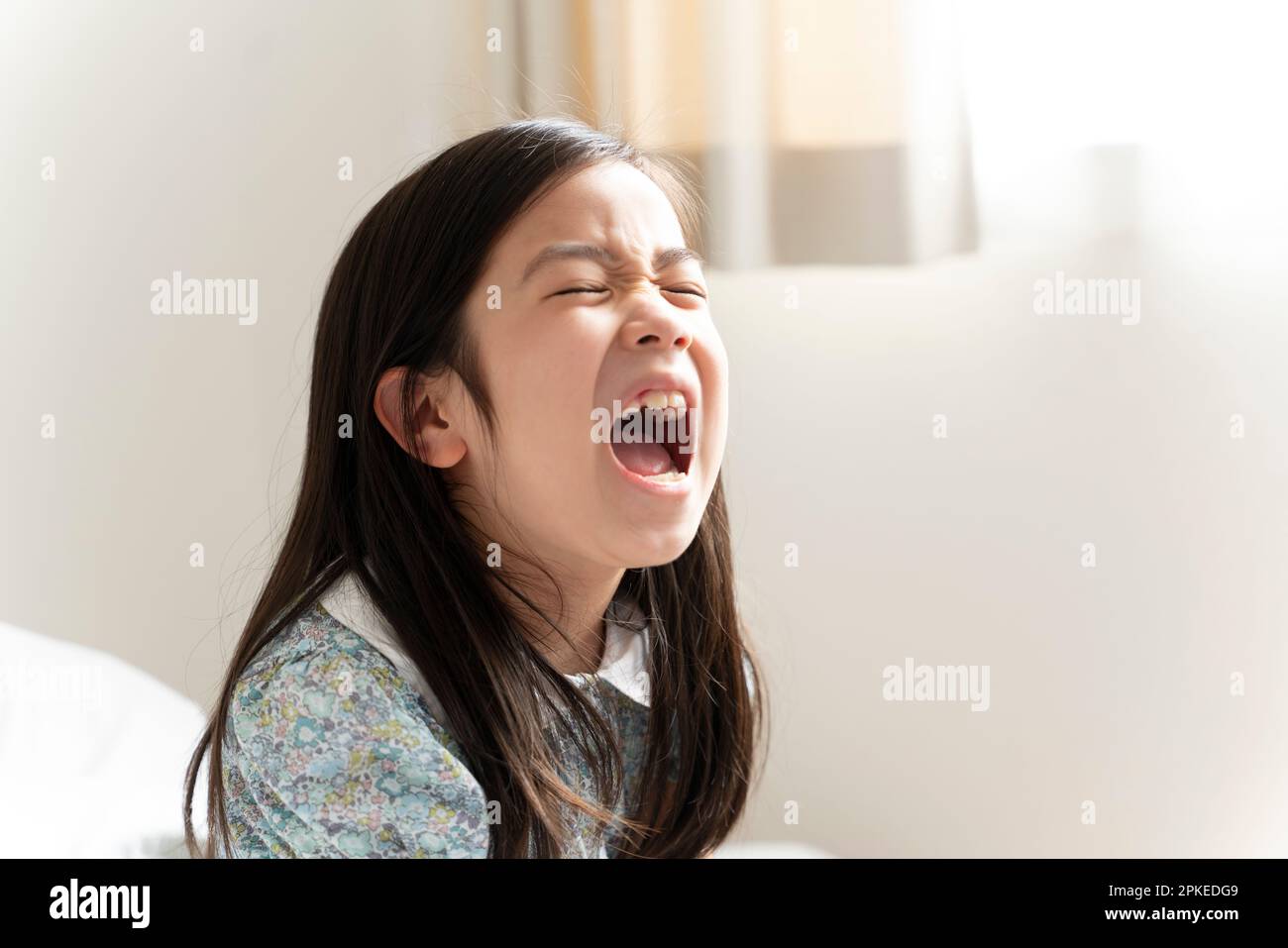 Girl screaming in her room Stock Photo - Alamy