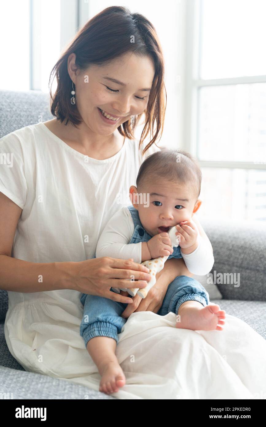 Mother baby teether hi-res stock photography and images - Alamy