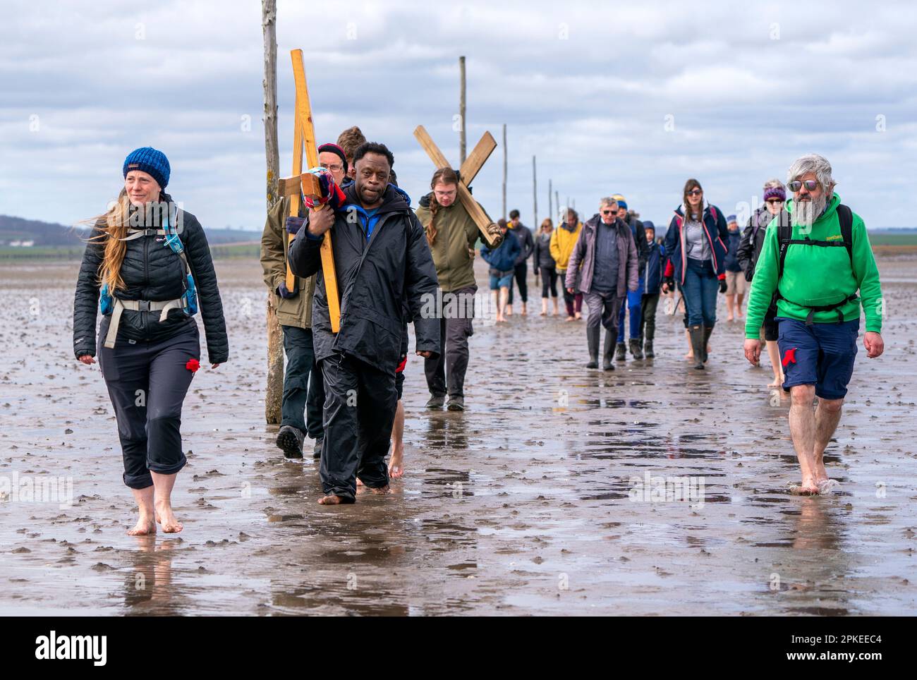 Pilgrims carrying crosses to the Holy Island of Lindisfarne in ...