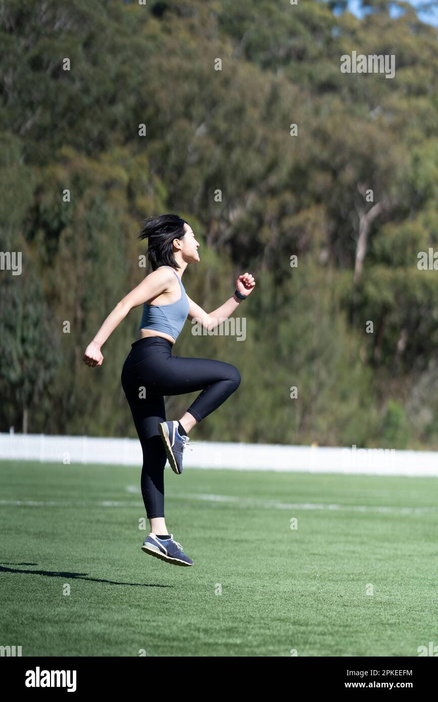 Woman jumping outdoors Stock Photo - Alamy