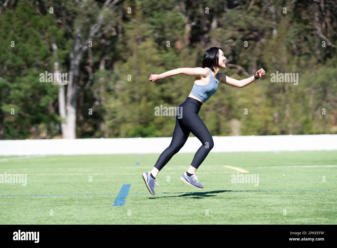 Woman dashing outdoors Stock Photo - Alamy