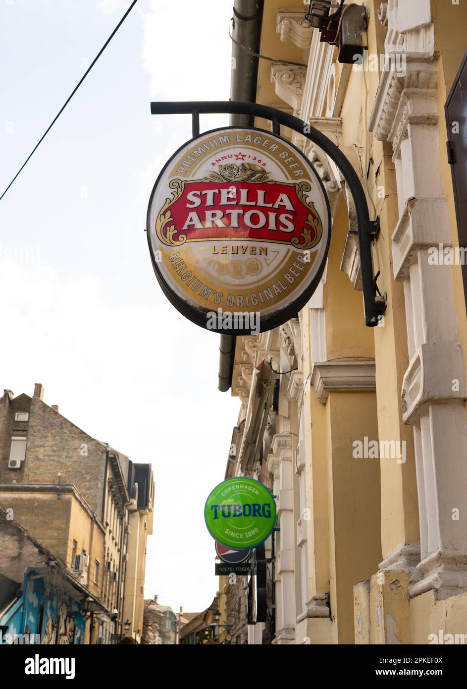 Hanging signboard Stella Artois Beer on street in european town. Novi ...