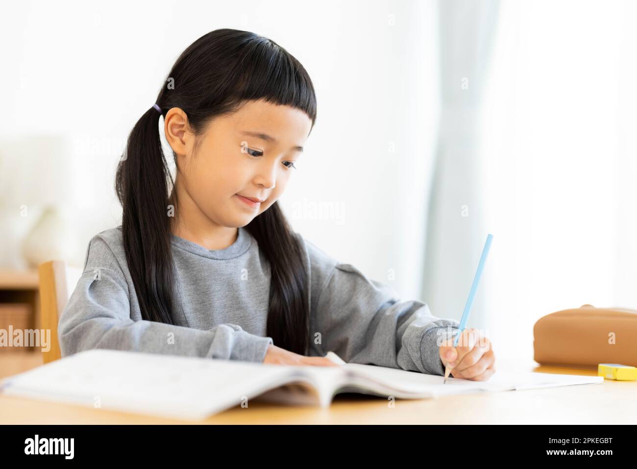 Girl studying at home Stock Photo - Alamy