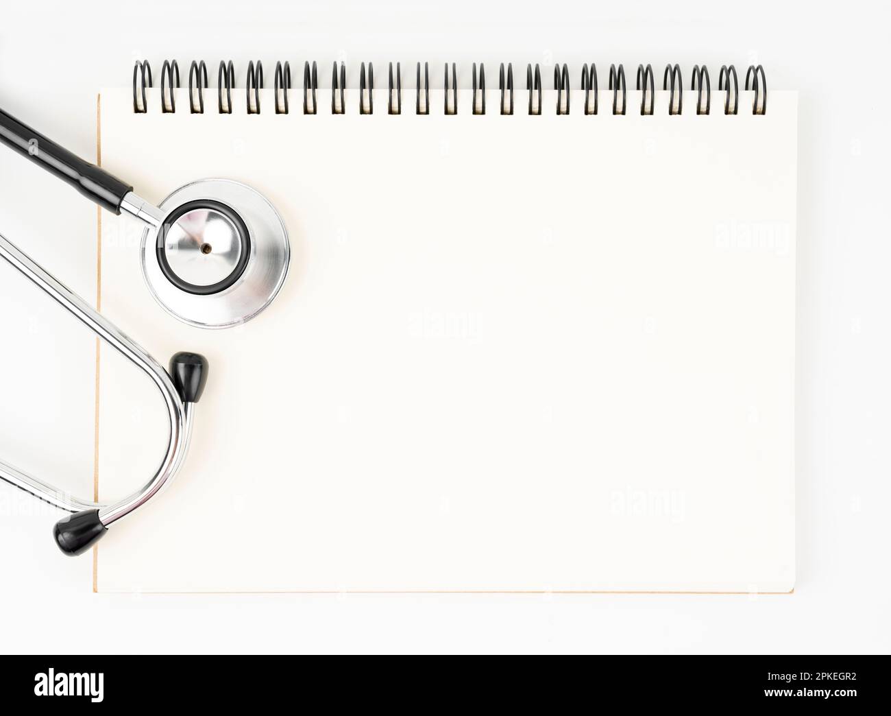 Blank medical notebook with stethoscope on white background Stock Photo ...