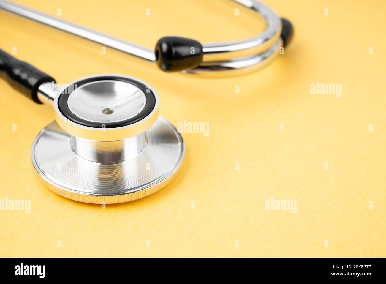 Medical background poster, stethoscope with space for text on yellow ...