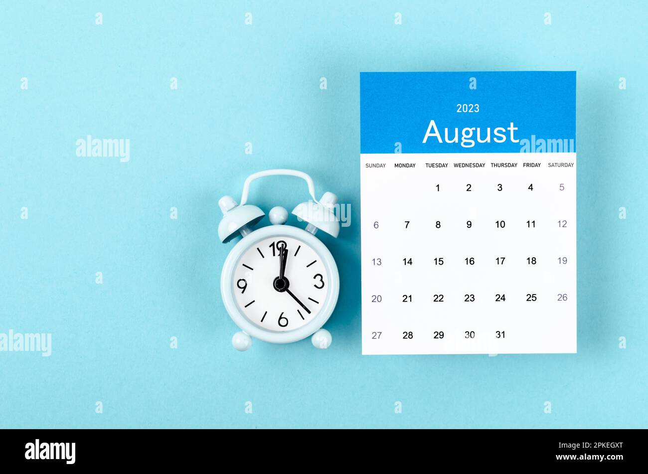August 2023 Monthly calendar for 2023 year with vintage alarm clock on ...