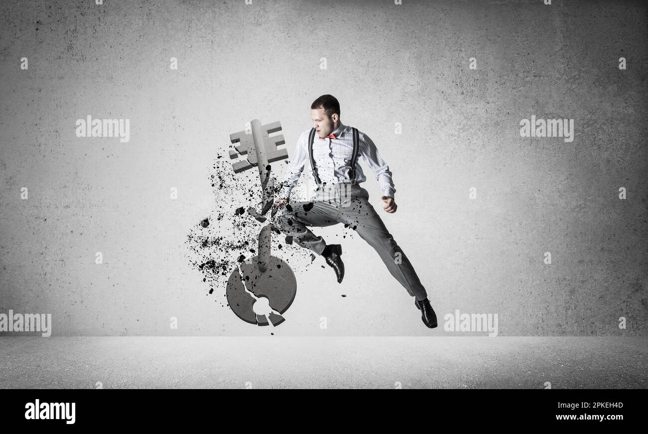 Breaking through access concept with furious man in room crashing ...