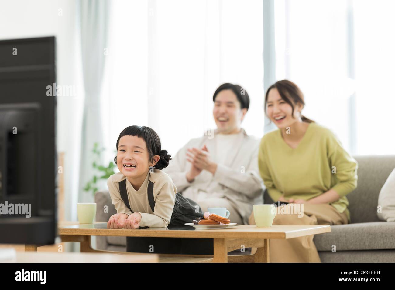 Family Watching TV Stock Photo - Alamy
