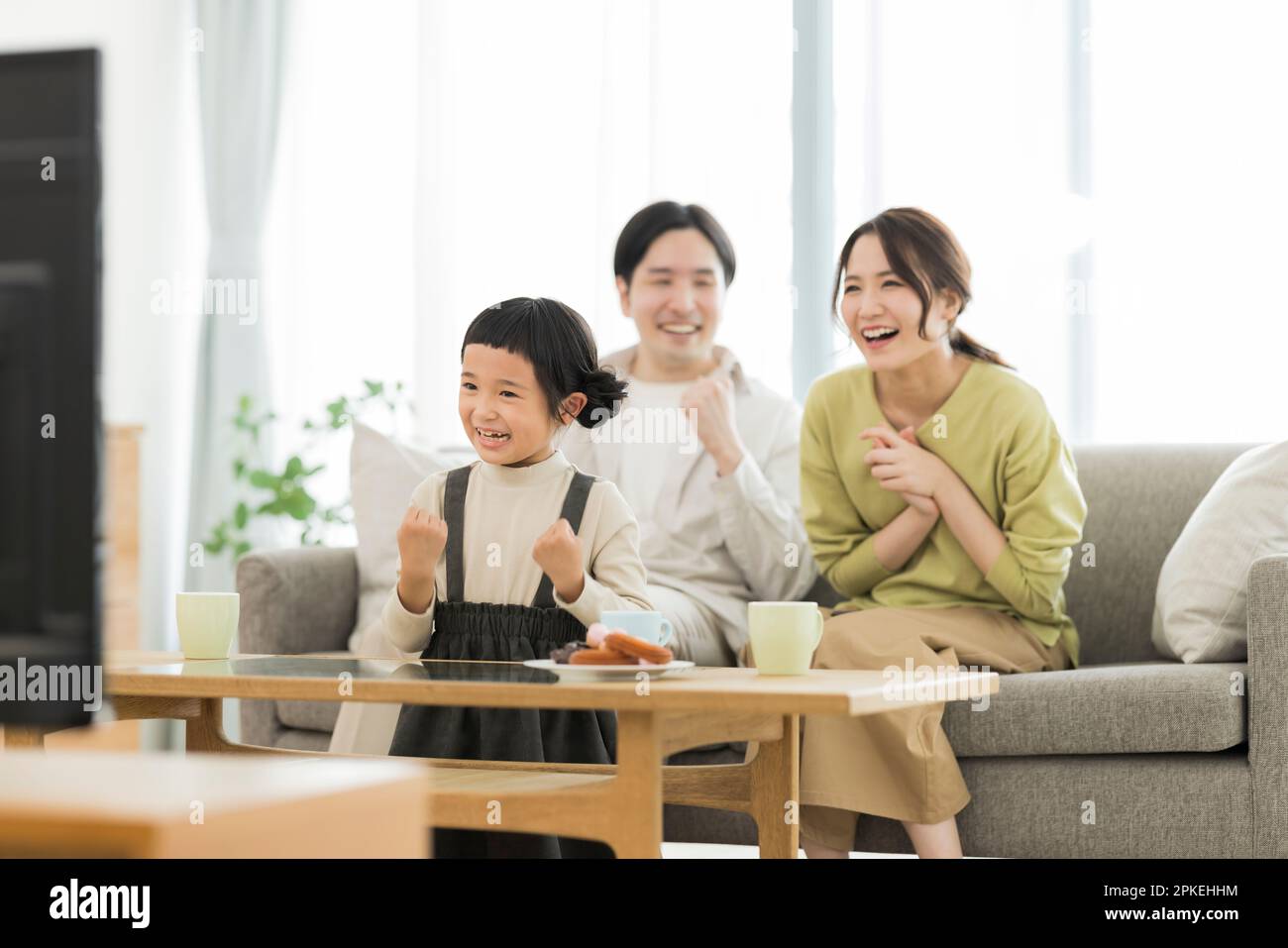 Family watching TV Stock Photo - Alamy