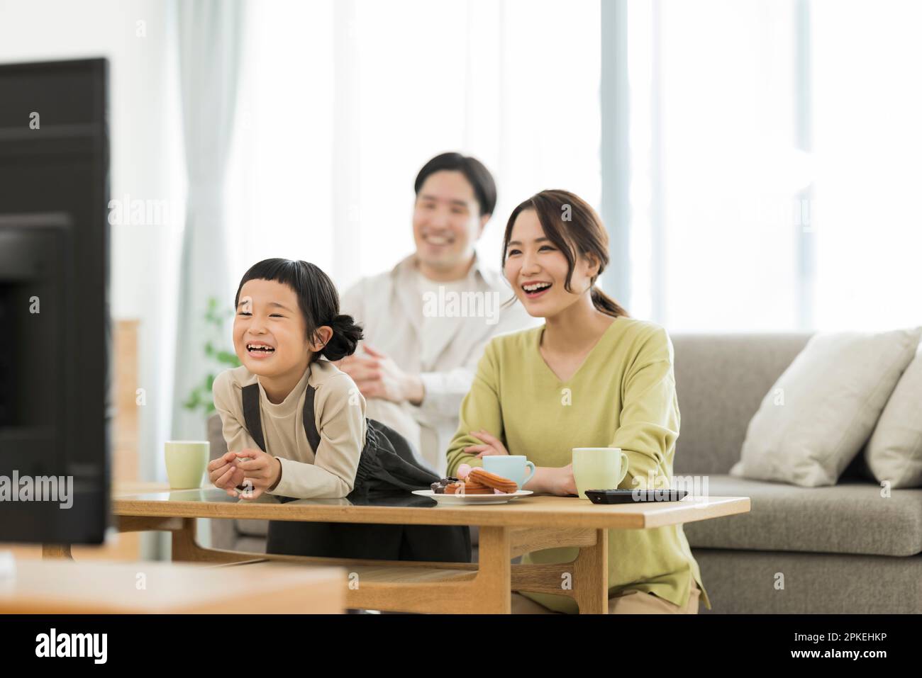 Family watching TV Stock Photo - Alamy