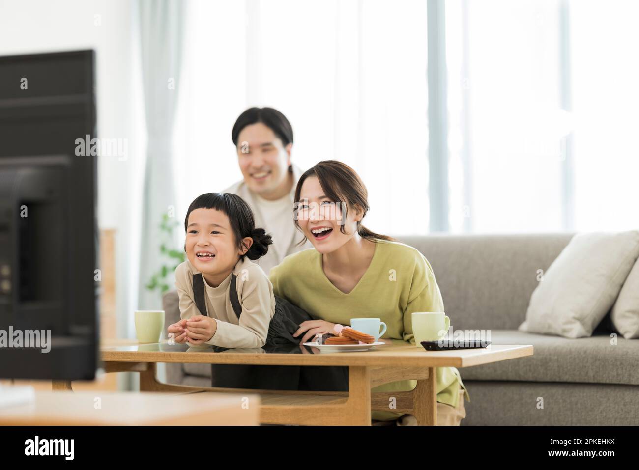 Family watching TV Stock Photo - Alamy