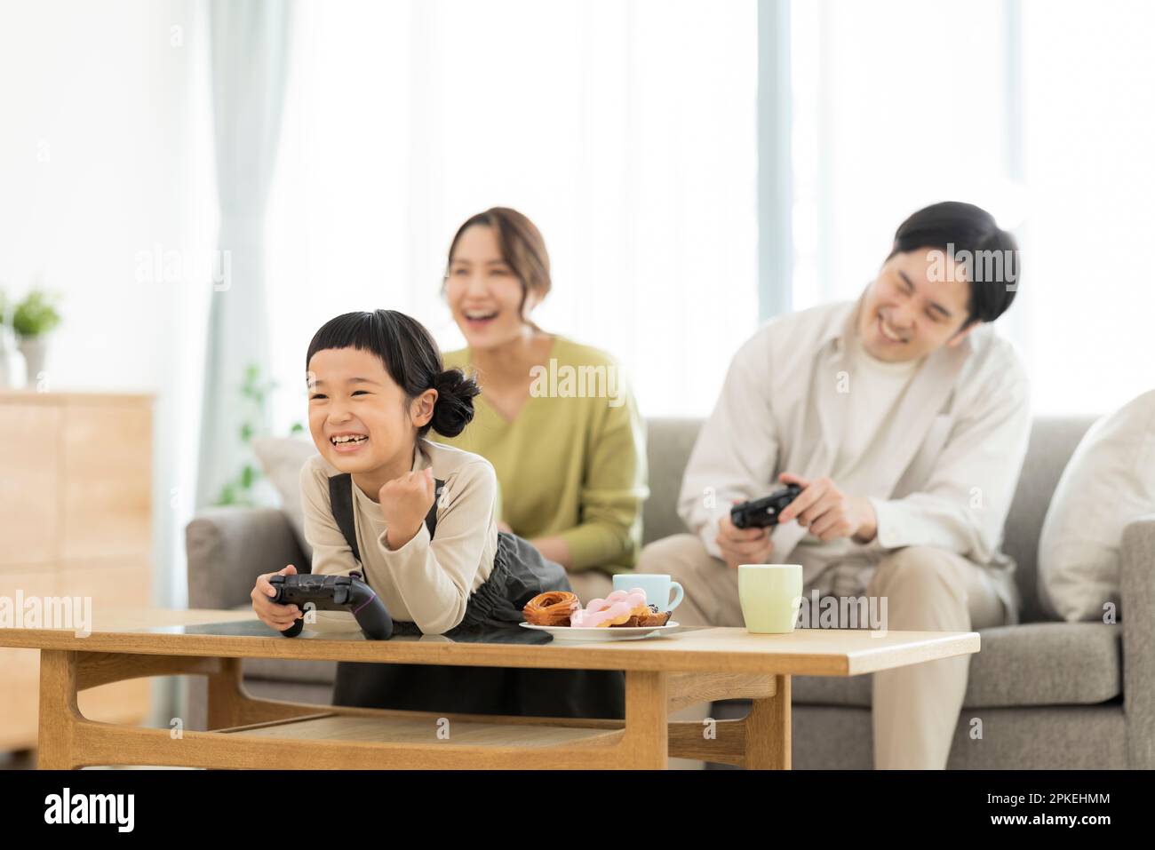 Families playing video games Stock Photo - Alamy