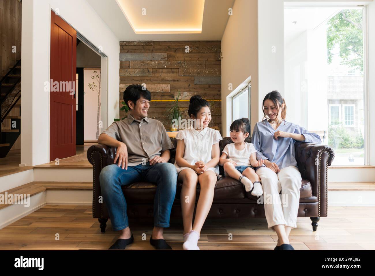 A family of four Stock Photo - Alamy