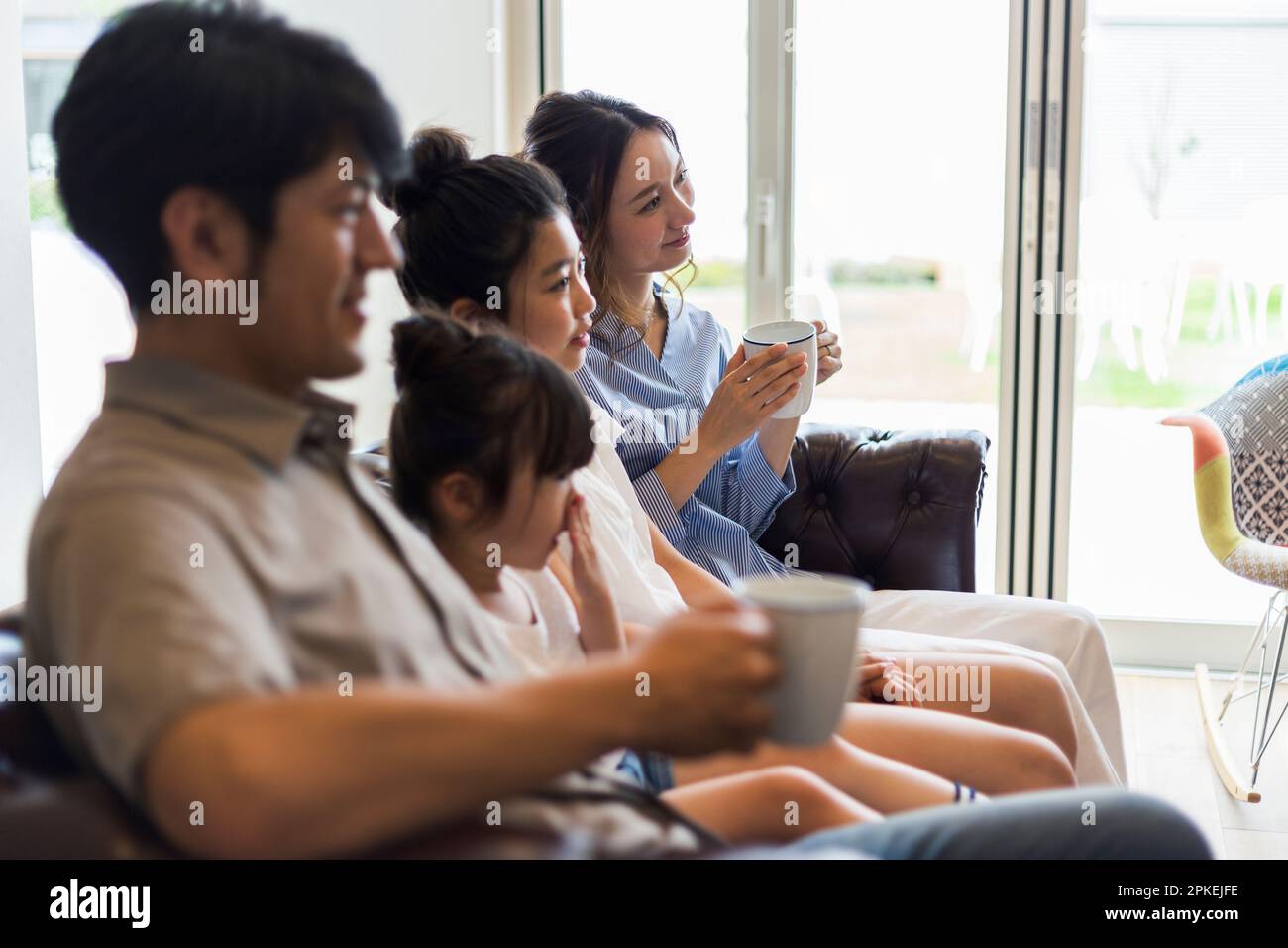 Watching tv at home real hi-res stock photography and images - Alamy