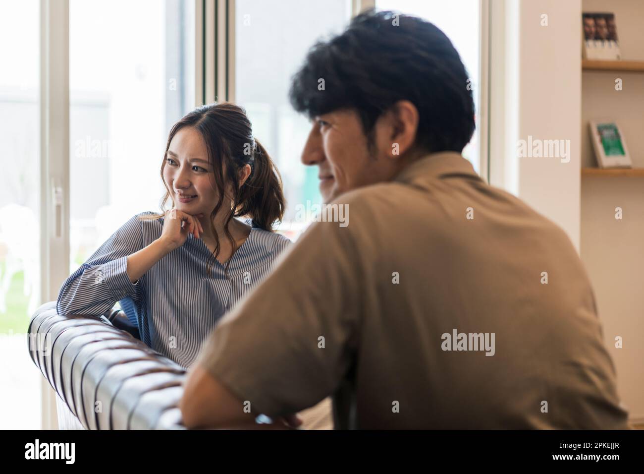 Parents watching over their children Stock Photo - Alamy