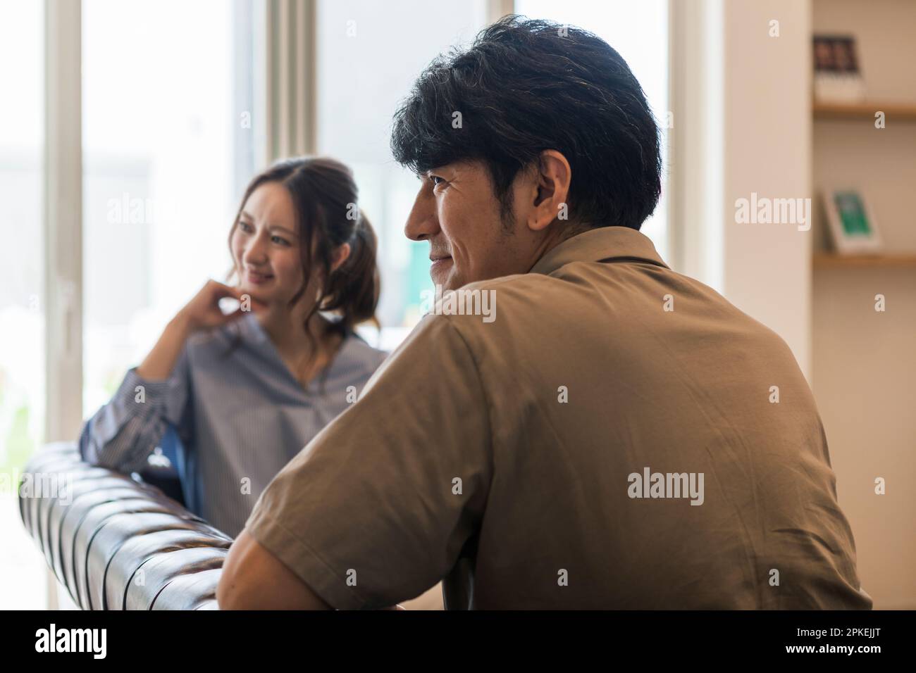 Parents watching over their children Stock Photo - Alamy