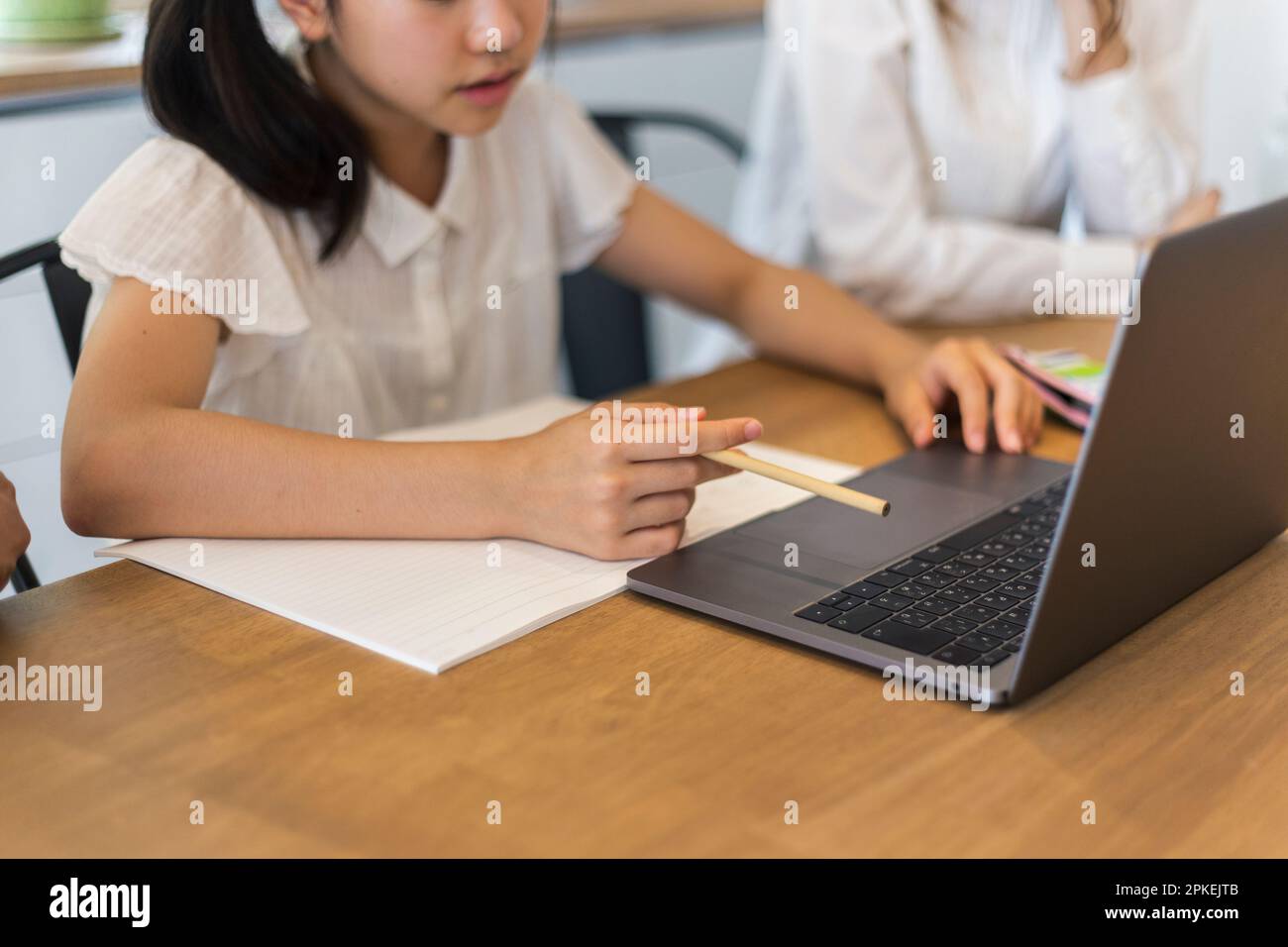 Girl taking online class Stock Photo - Alamy