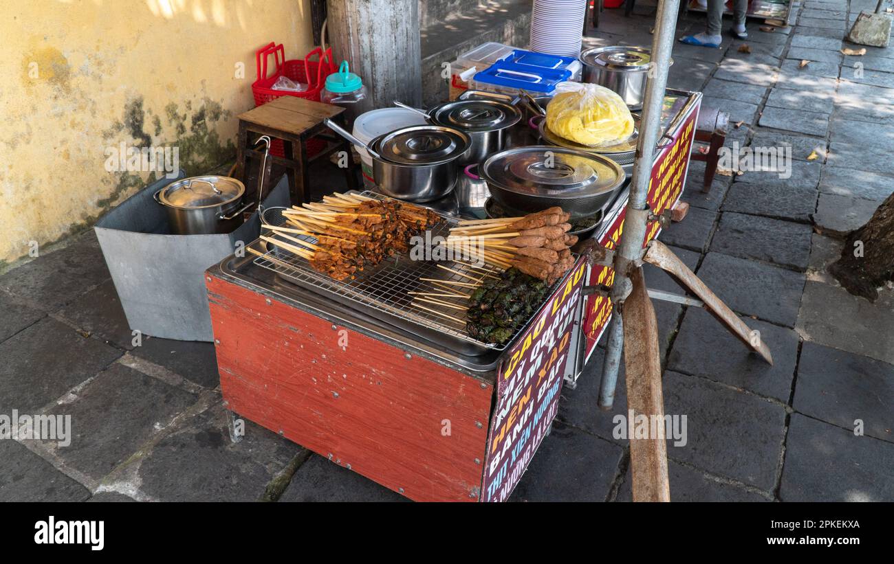 Asian street food, how to cook on the street Stock Photo - Alamy