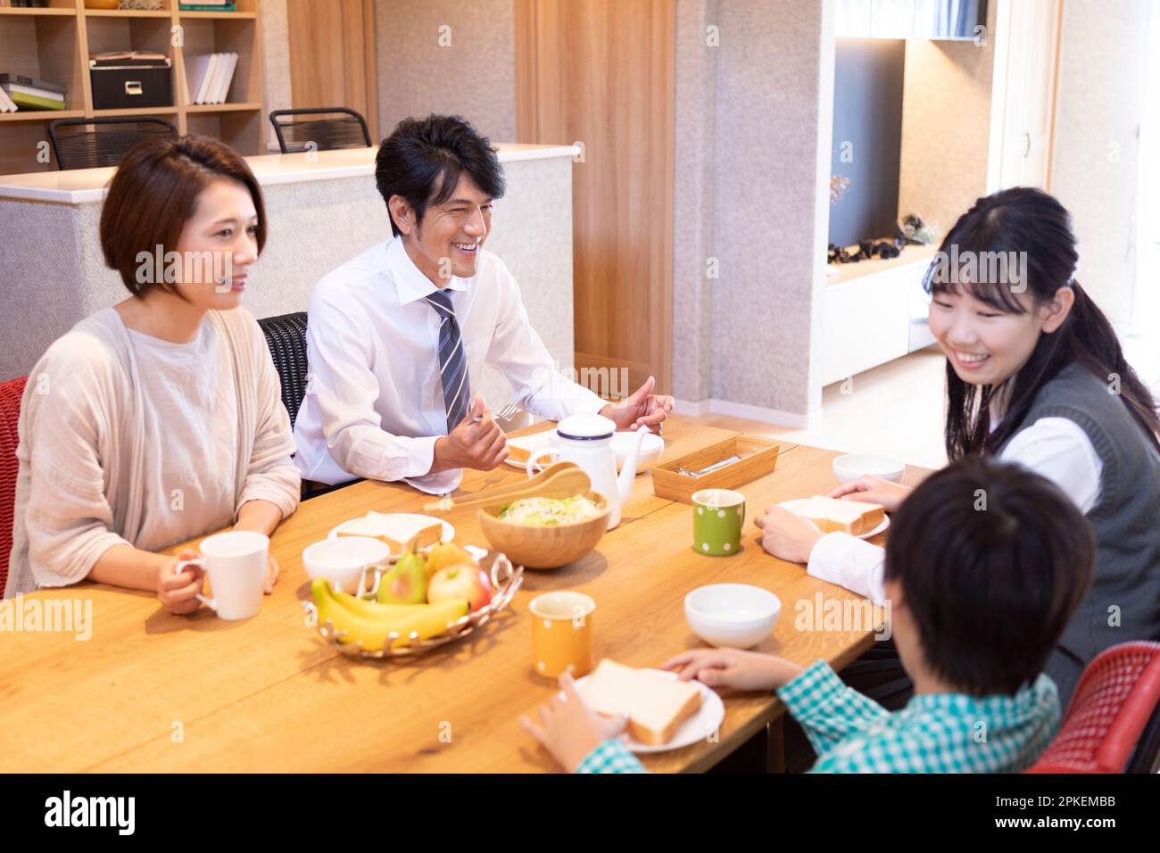 A family eating breakfast Stock Photo - Alamy
