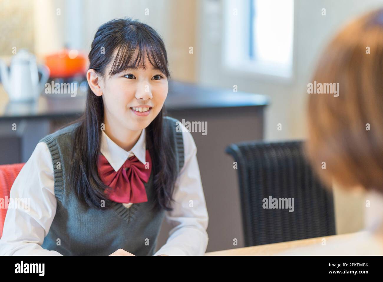 High school girl talking with her mother Stock Photo - Alamy