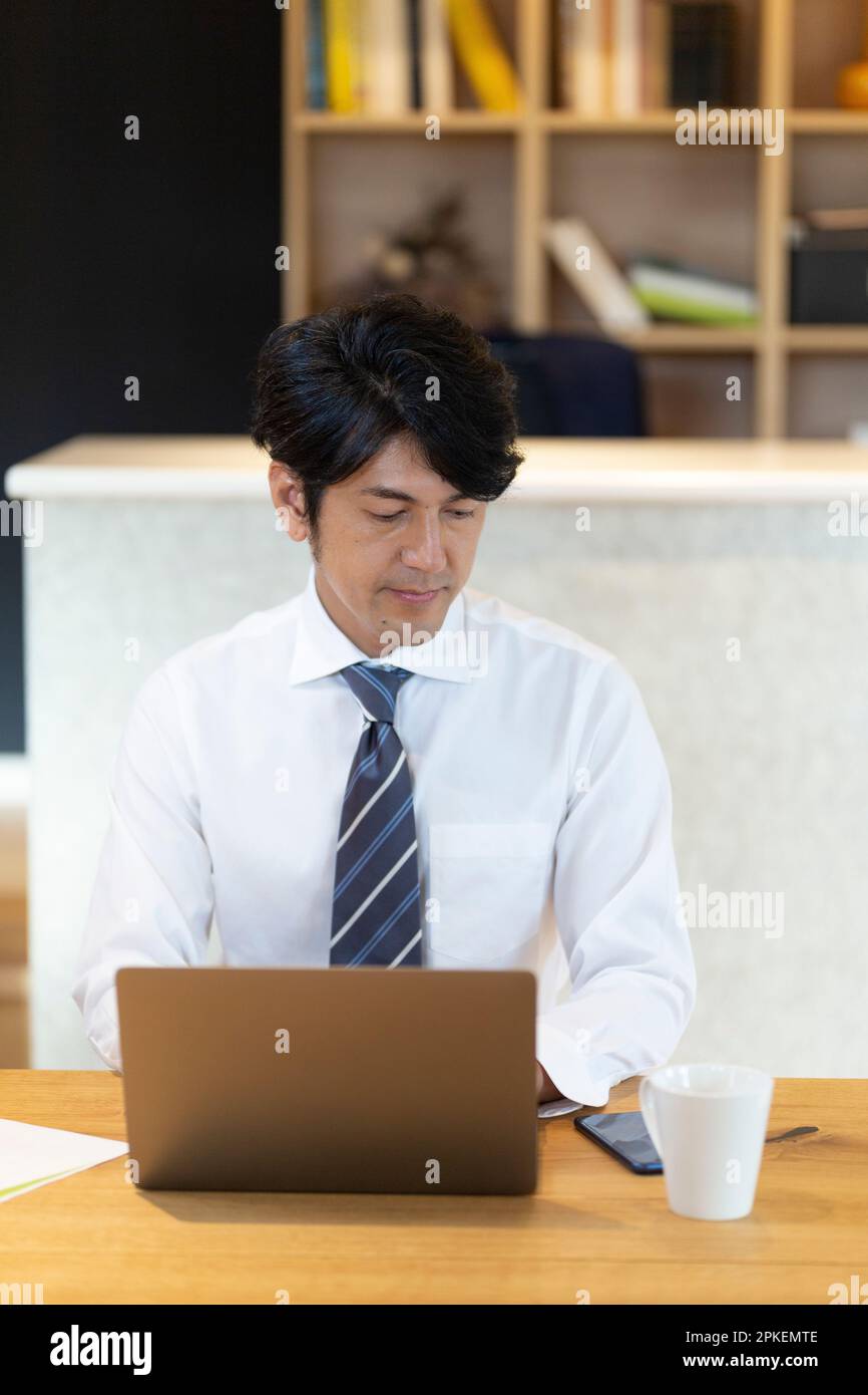 Asian businessman dining hi-res stock photography and images - Alamy
