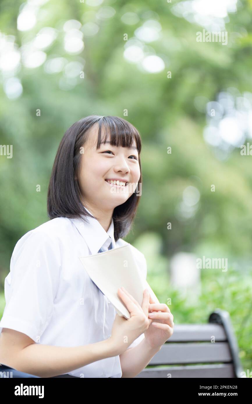 High school girls reading Stock Photo - Alamy