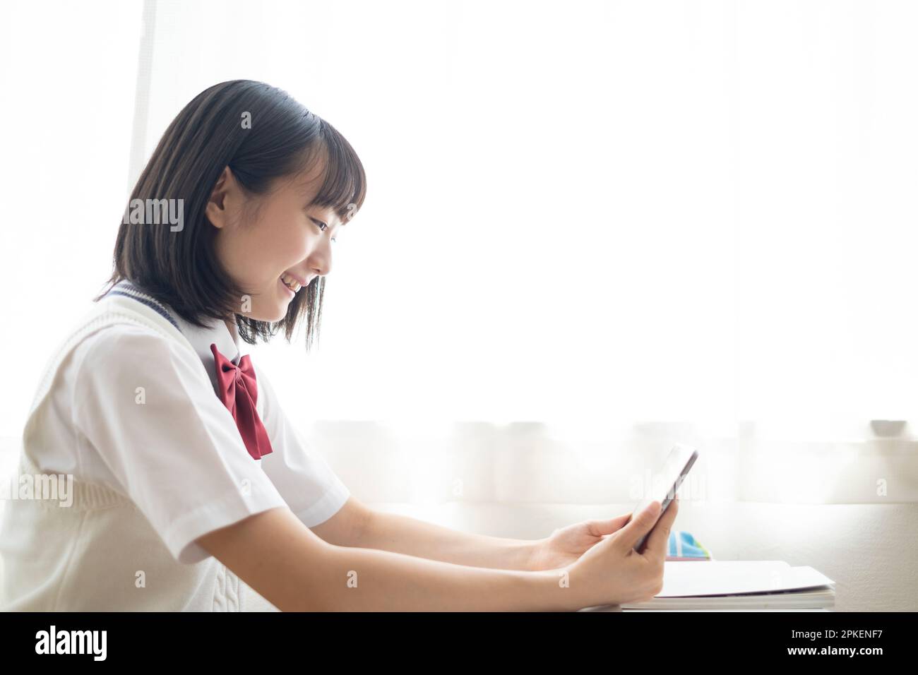 High school girls taking a class Stock Photo - Alamy