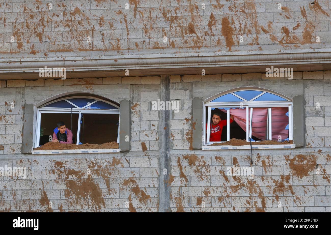 Palestinians look out of their destroyed house after Israel launched ...