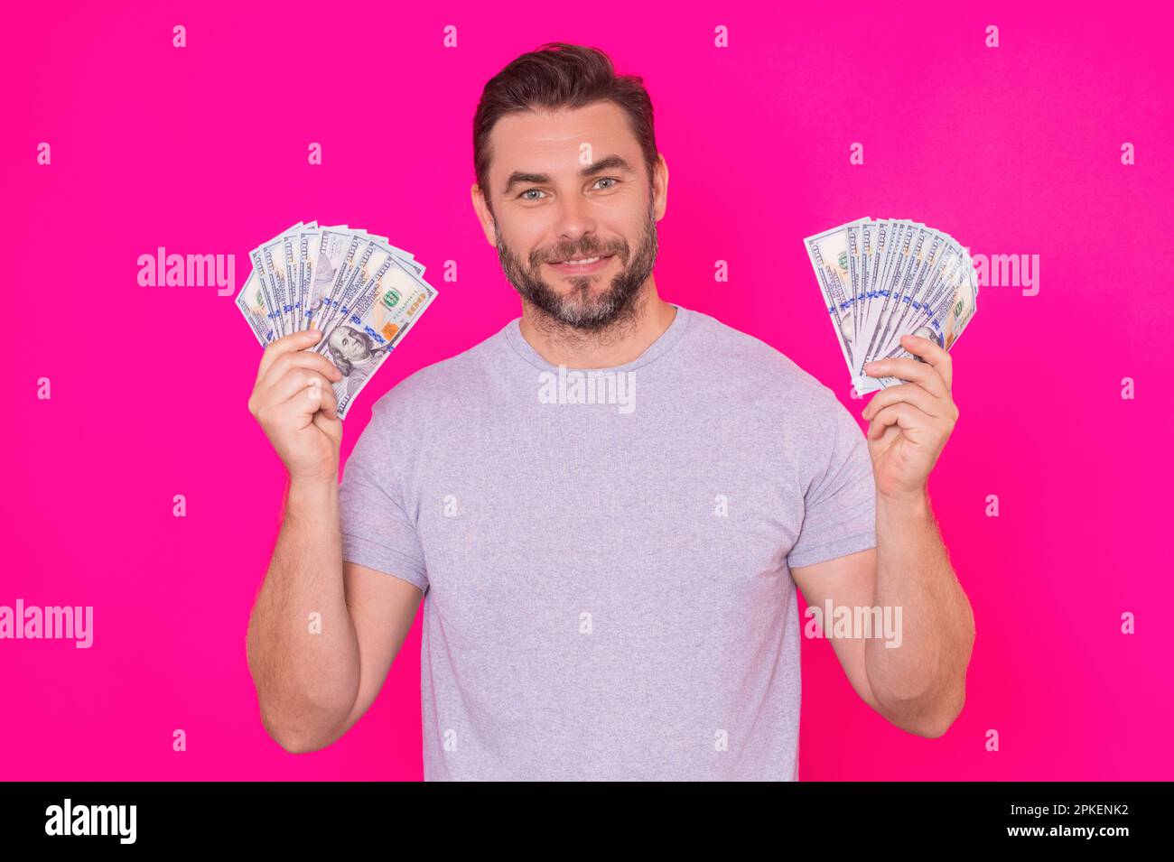 Attractive business man counting money. Handsome middle age man holding ...