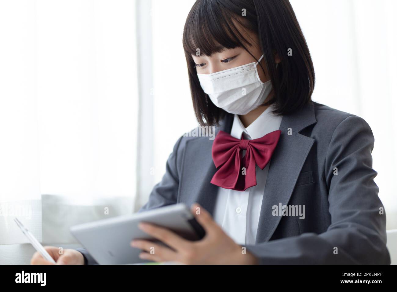 High school girls wearing masks in class Stock Photo - Alamy